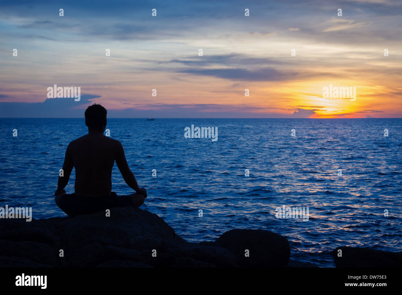 Young man at ocean coastline hi-res stock photography and images - Alamy