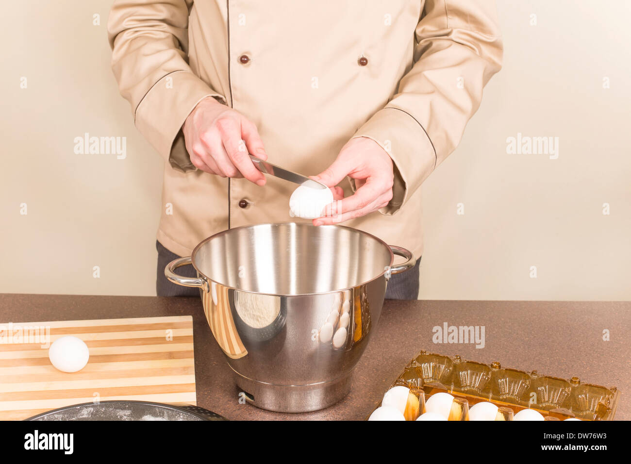 chef knife splits chicken eggs Stock Photo - Alamy