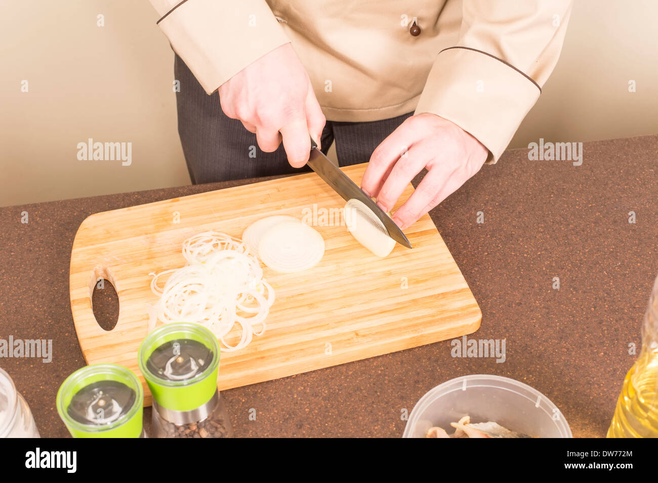 chef ceramic knife chop onion rings Stock Photo - Alamy