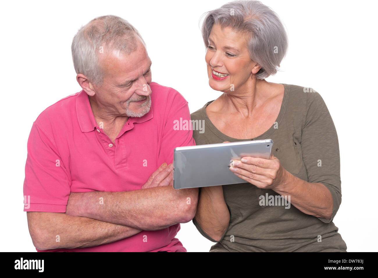 Senior couple with tablet computer in front of white background Stock ...