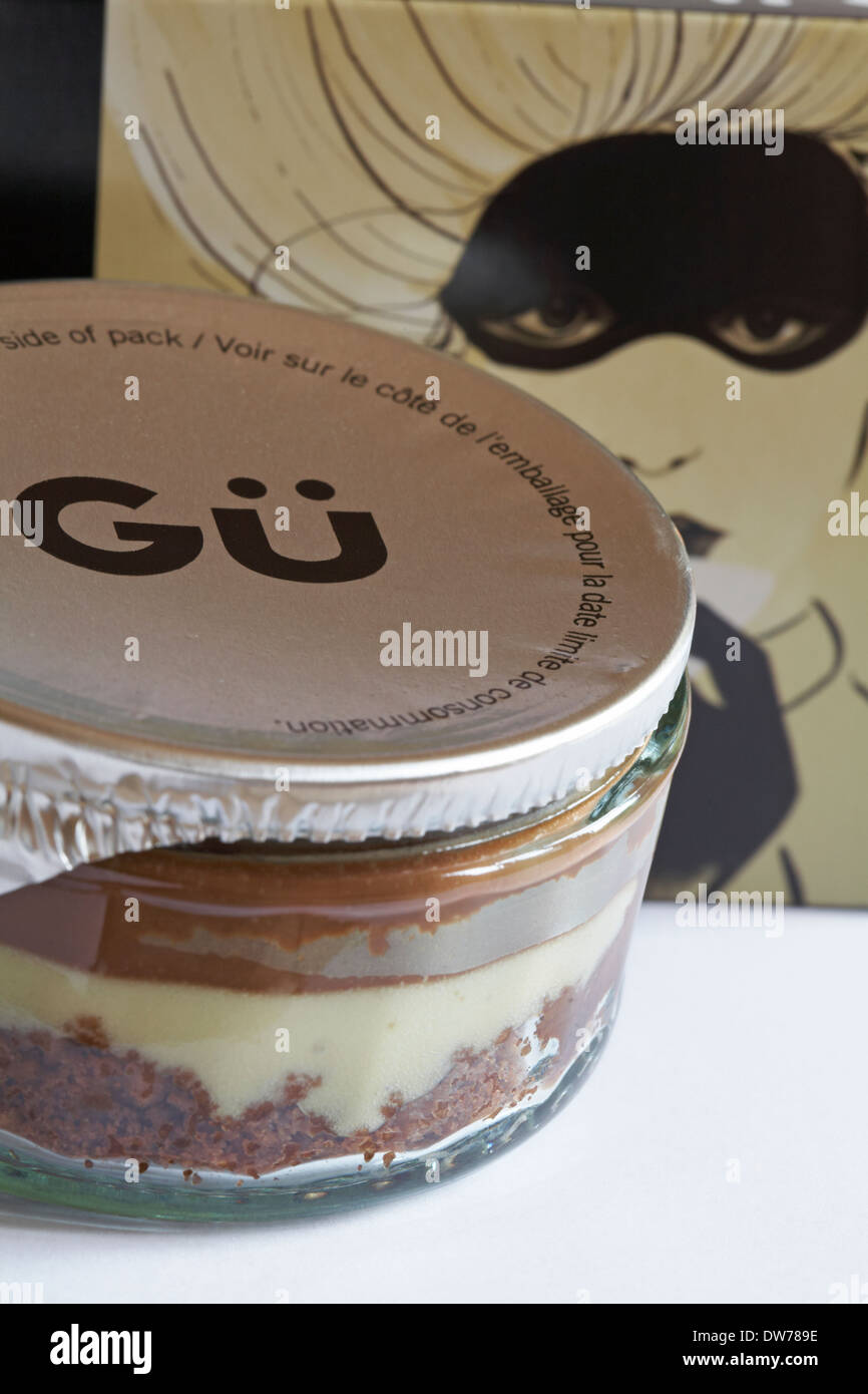 Gu After Dark Chocolate & Vanilla Cheesecakes set on white with one ...