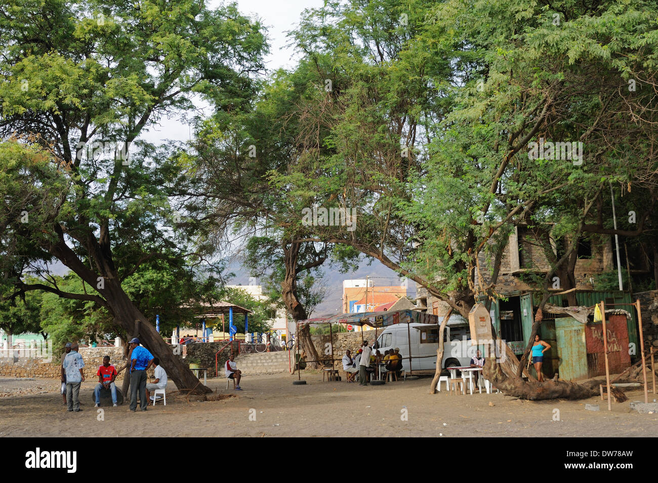 African village scene Porto Novo in Cape Verde with the locals relaxing ...