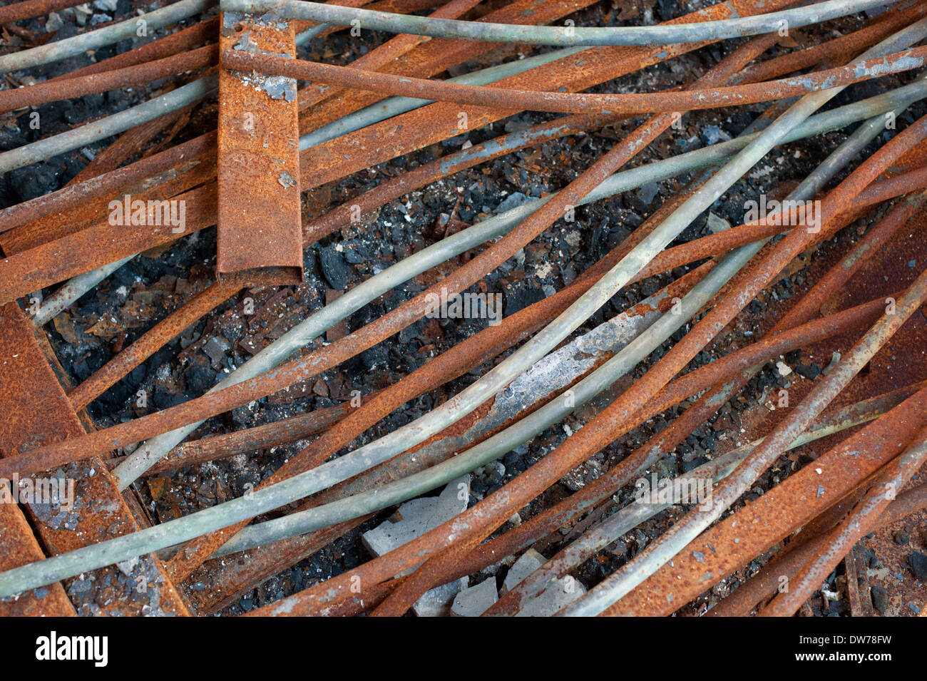 rusted metal rods on the floor of a burned out warehouse Stock Photo ...