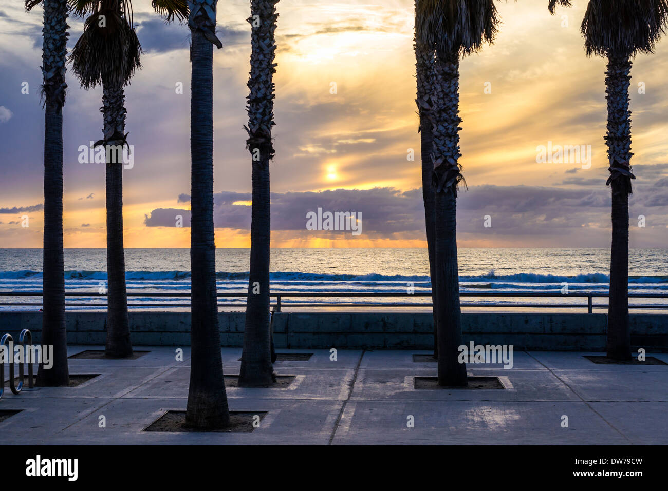 Sunset viewed from the Mission Beach Boardwalk. San Diego, California ...
