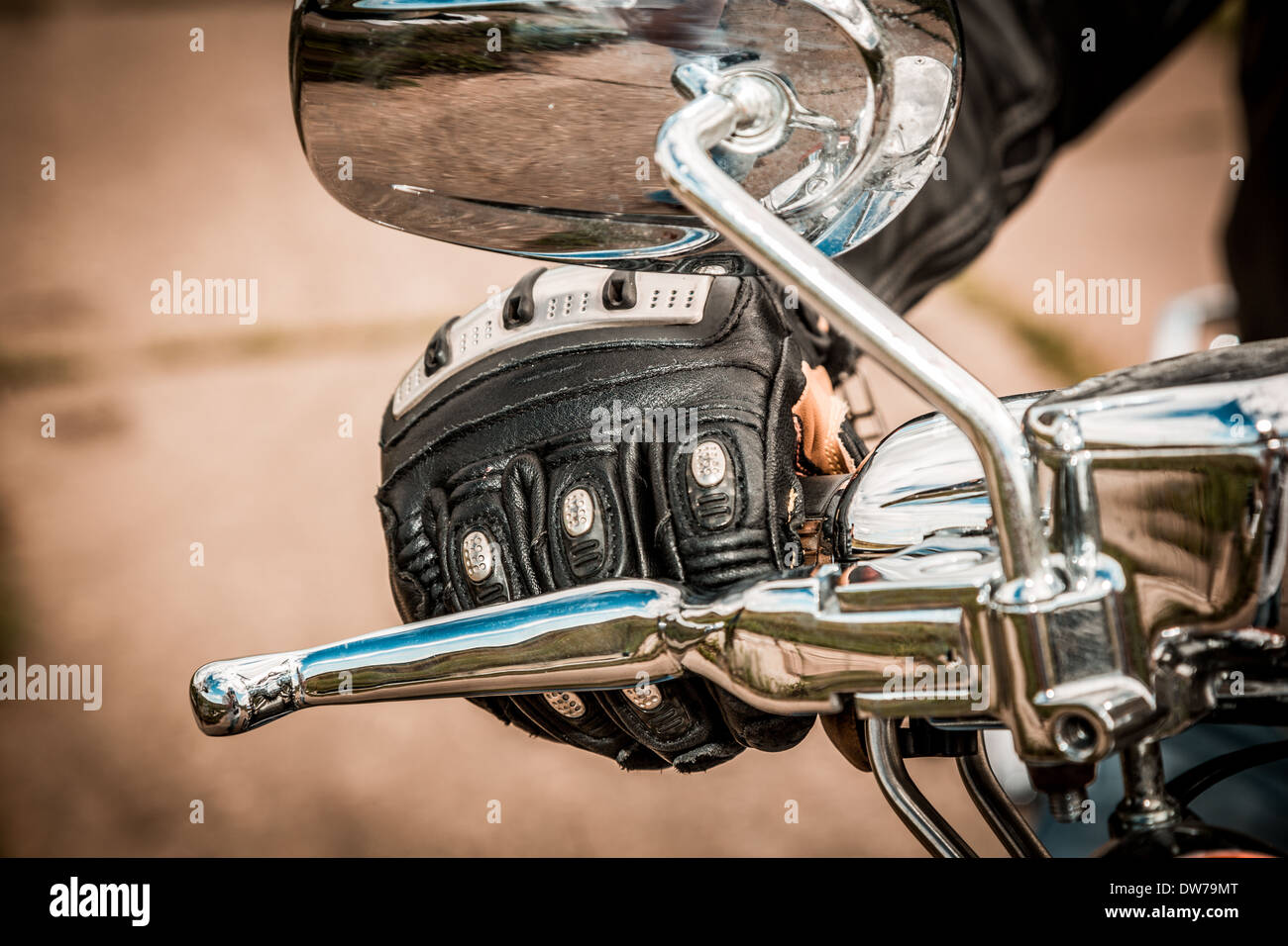 Human hand in a Motorcycle Racing Gloves holds a motorcycle throttle ...