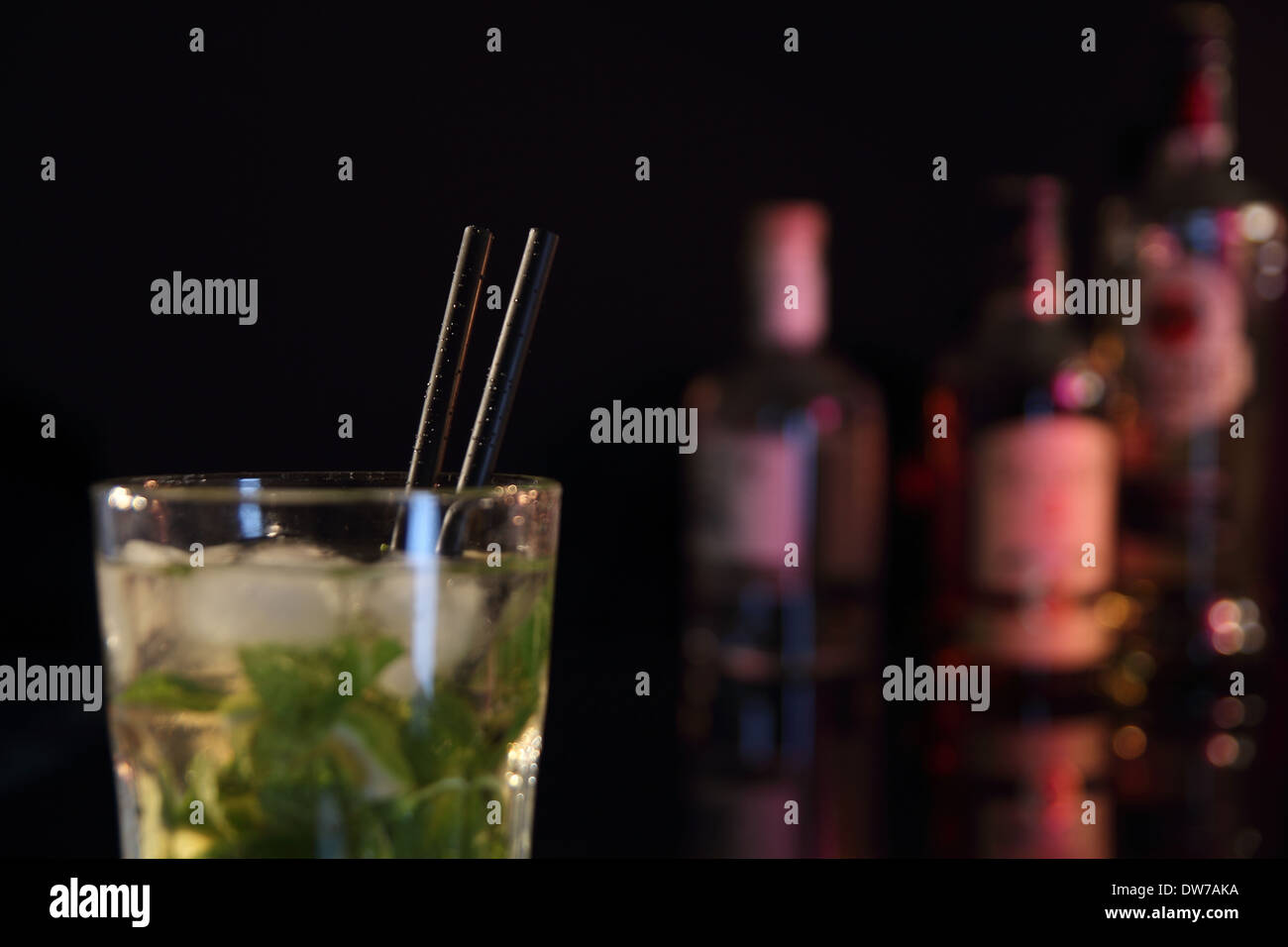 Cocktail on a Bar with bottles Stock Photo - Alamy
