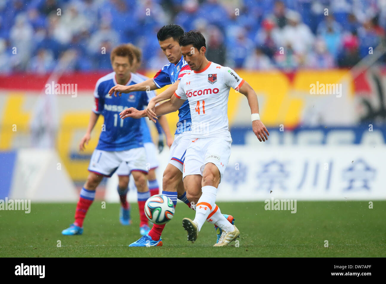 Nissan Stadium, Kanagawa, Japan. 2nd Mar, 2014. (L to R) Seitaro Tomisawa (F Marinos), Akihiro ...