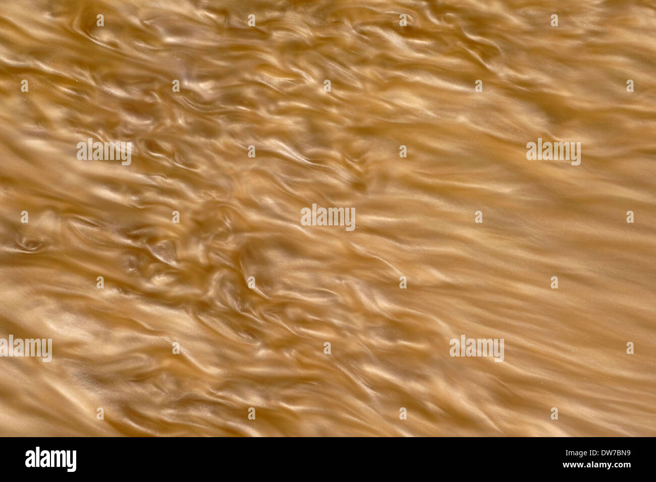 Patterns of swirling sediment in a mud puddle on the Annapurna road ...