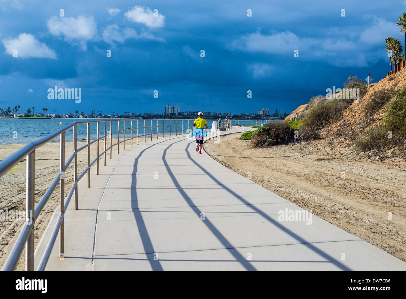 A runner on a pathway along Mission Bay. San Diego, California, United ...