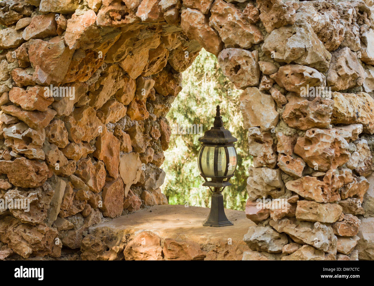 Beautiful photo of an old street lamp on a stone wall Stock Photo - Alamy
