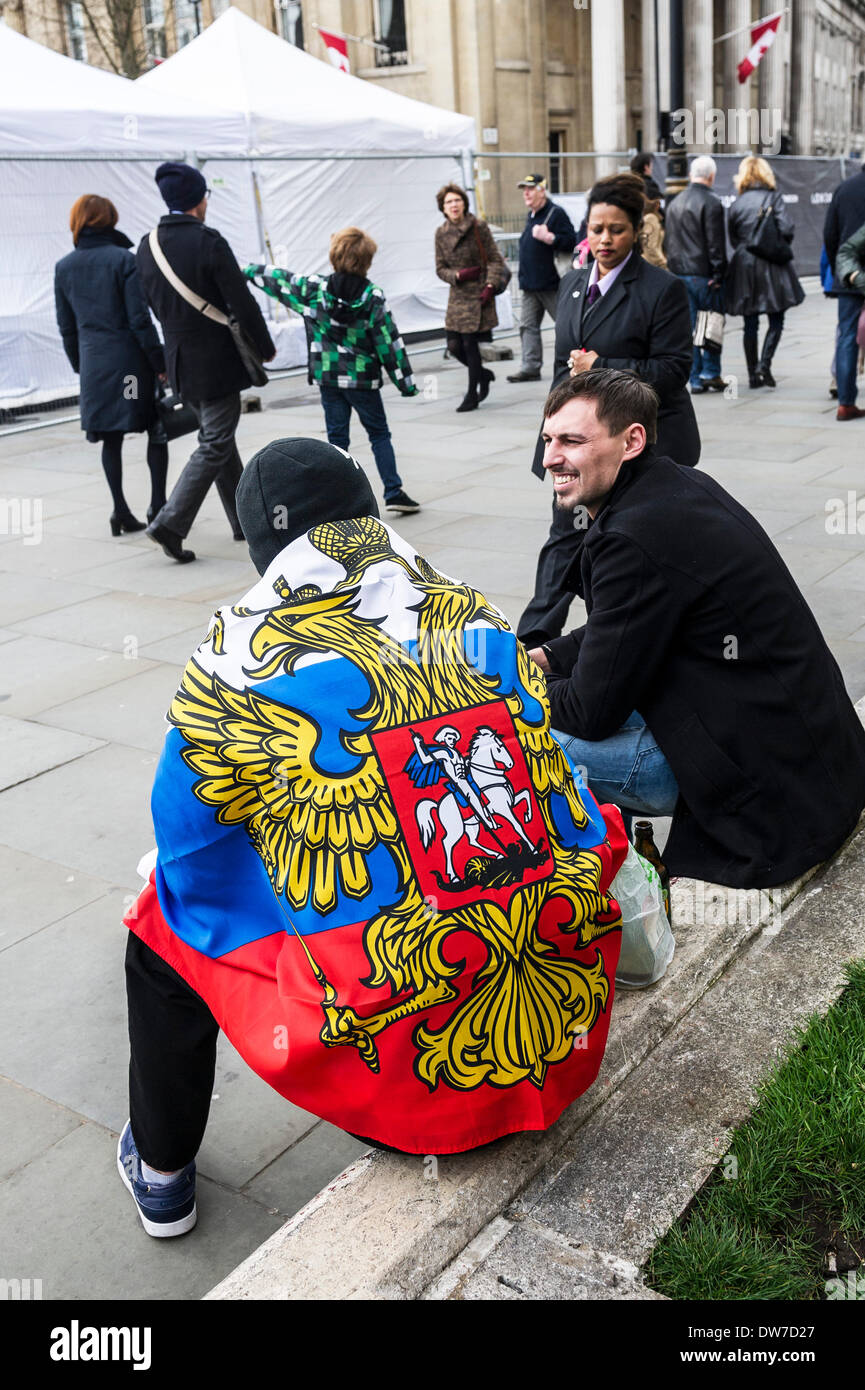 London, UK. March 3rd 2014. An individual with a Russian flag draped ...