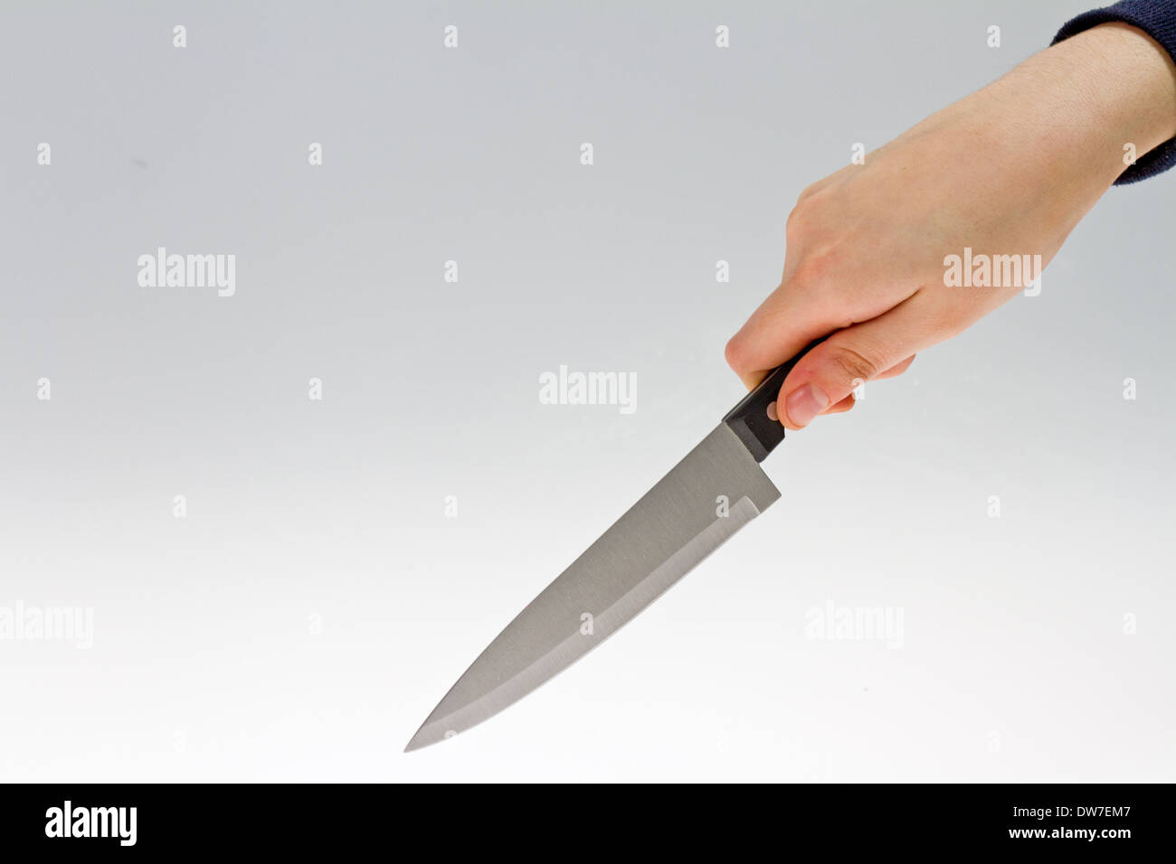 Hand Holding a Knife Stock Photo - Alamy