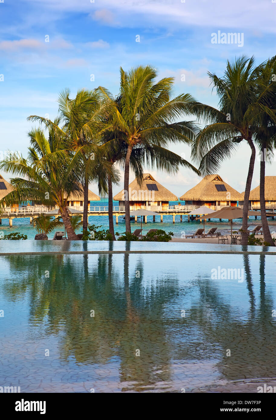 seacoast with palm trees and small houses on water Stock Photo - Alamy