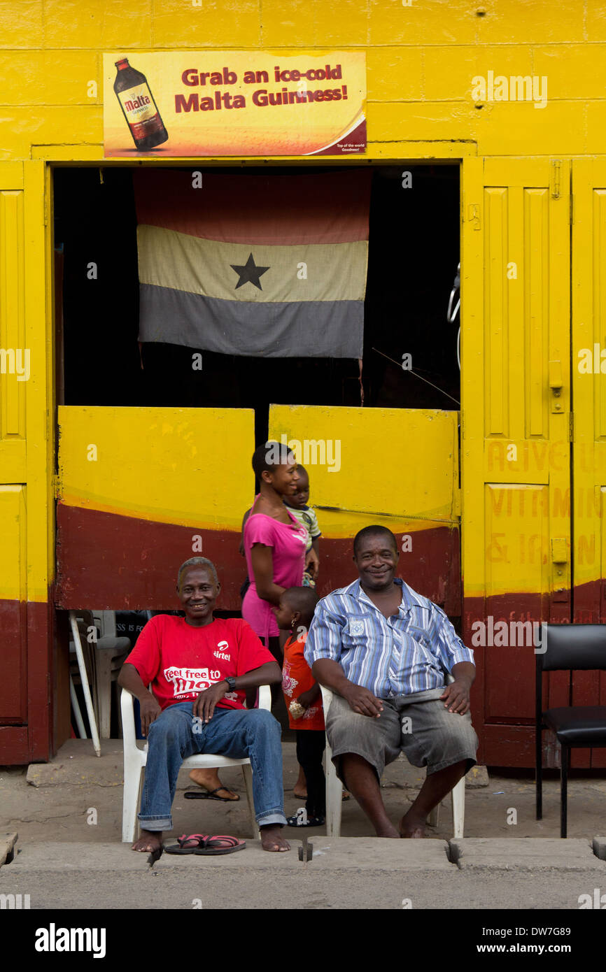 Friends sitting outside a bar in Cape Coast, Ghana Stock Photo - Alamy