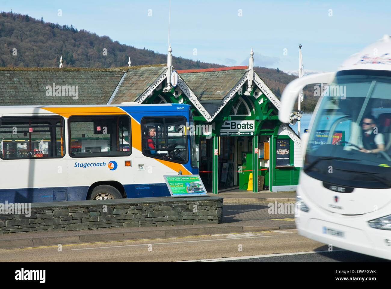Bus and coach passing Bowness Bay, Lake District National Park, England ...