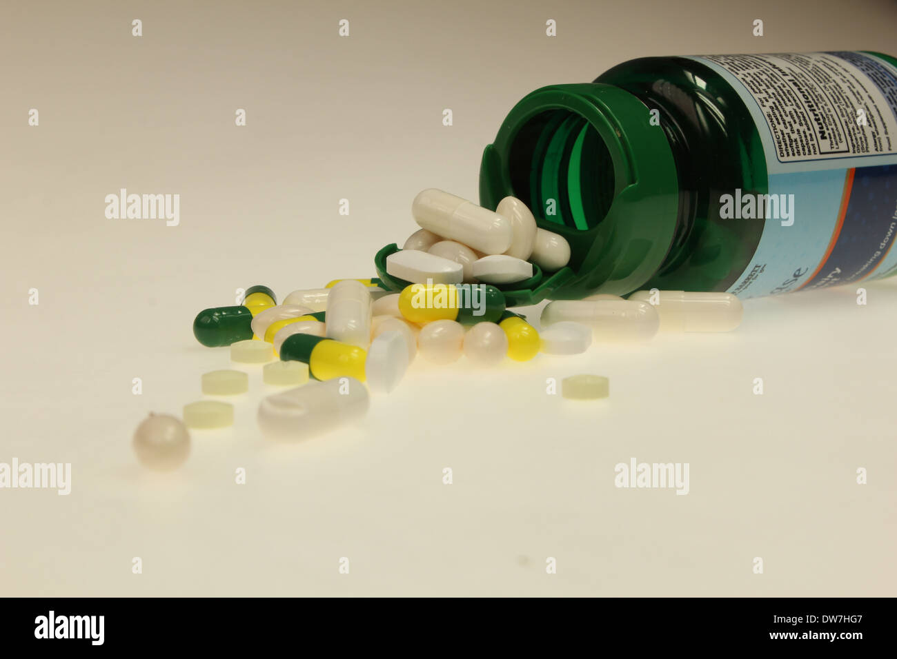 Pot of Pills spilling, 02-03-2014 Stock Photo - Alamy