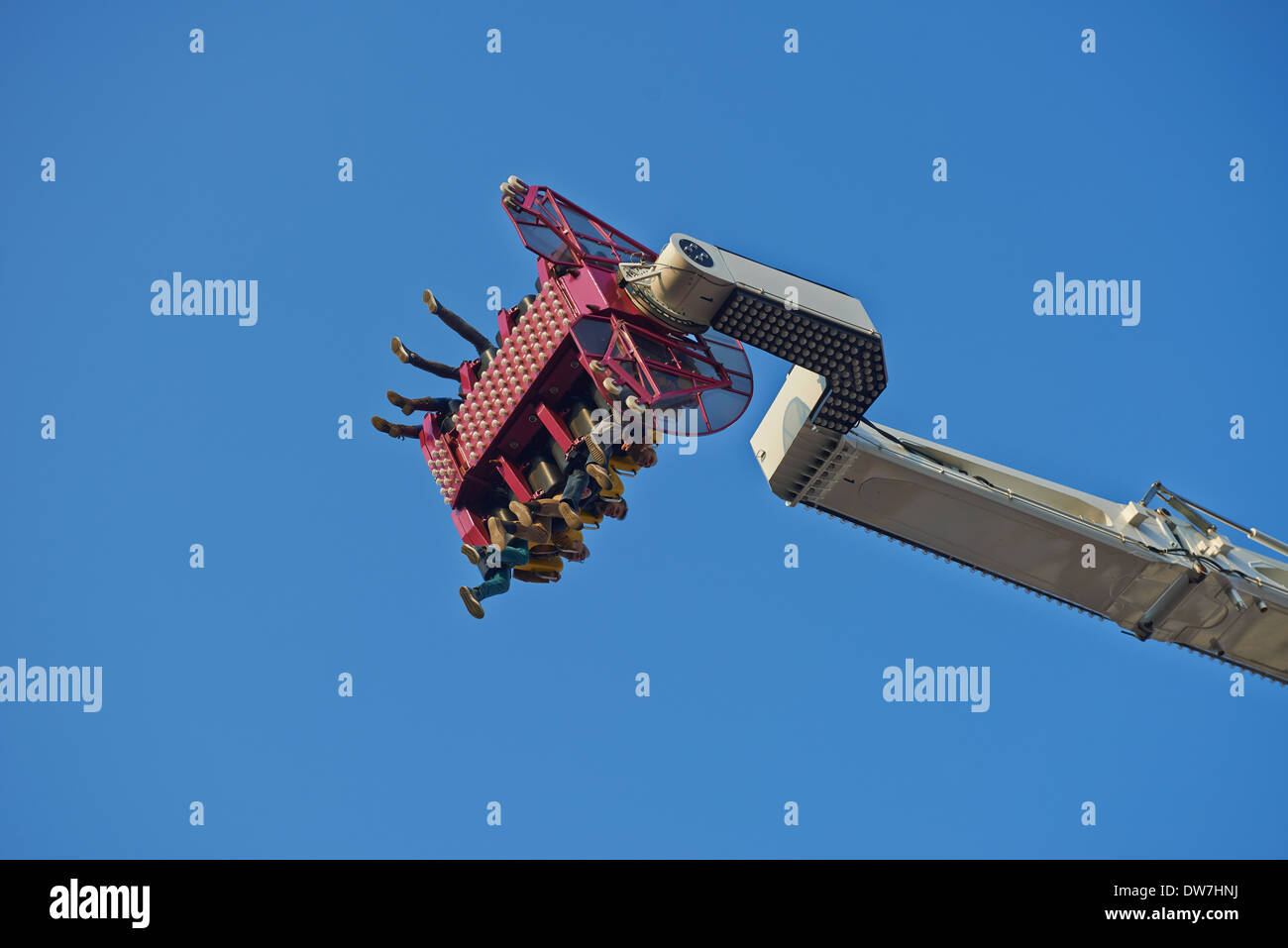 Claw which is a ride that spins people upside down. a carnival ride on ...