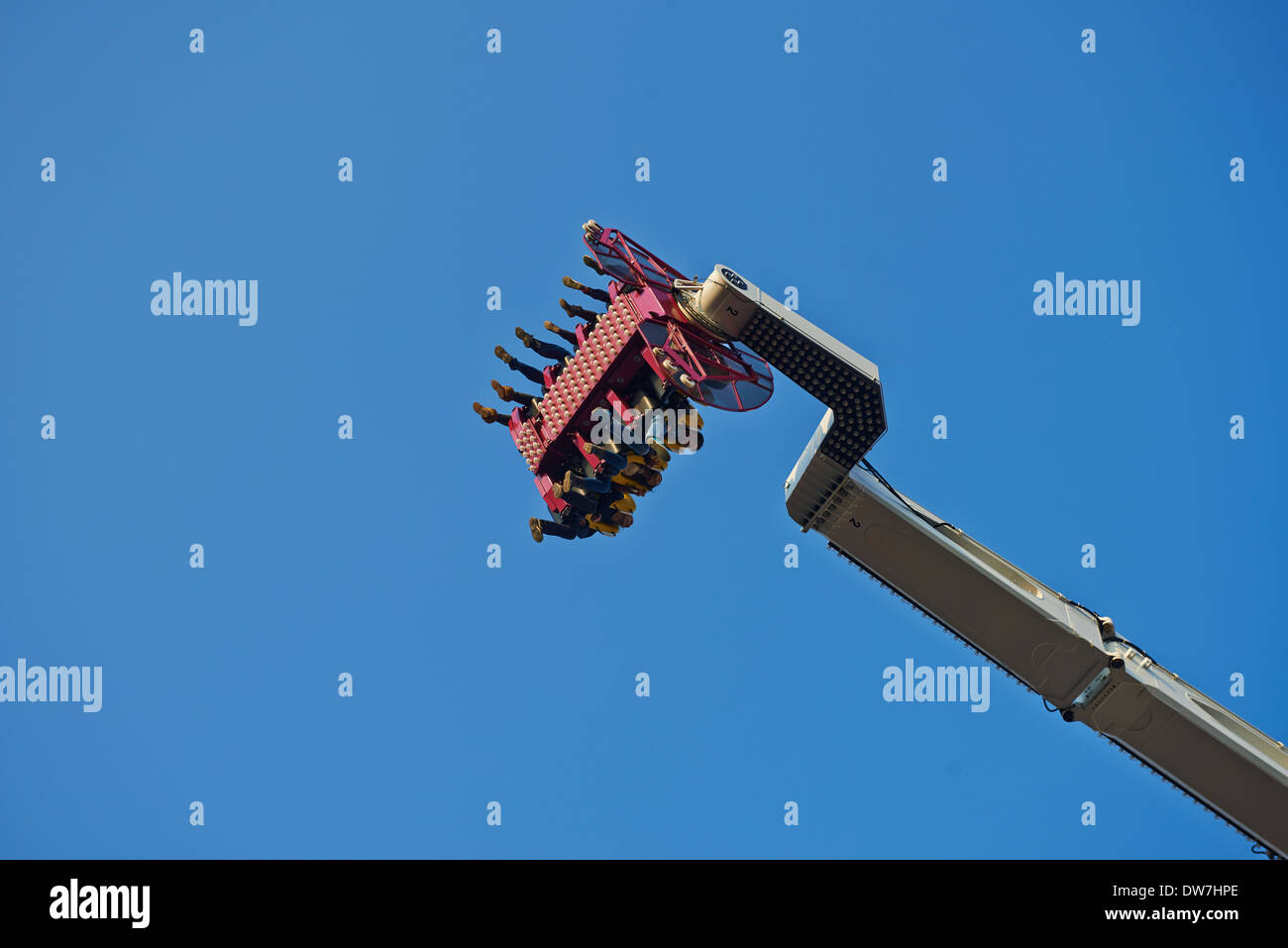 Claw which is a ride that spins people upside down. a carnival ride on ...