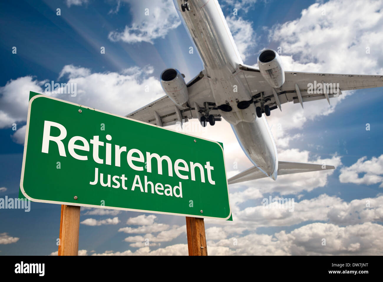 Retirement Green Road Sign and Airplane Above with Dramatic Blue Sky ...