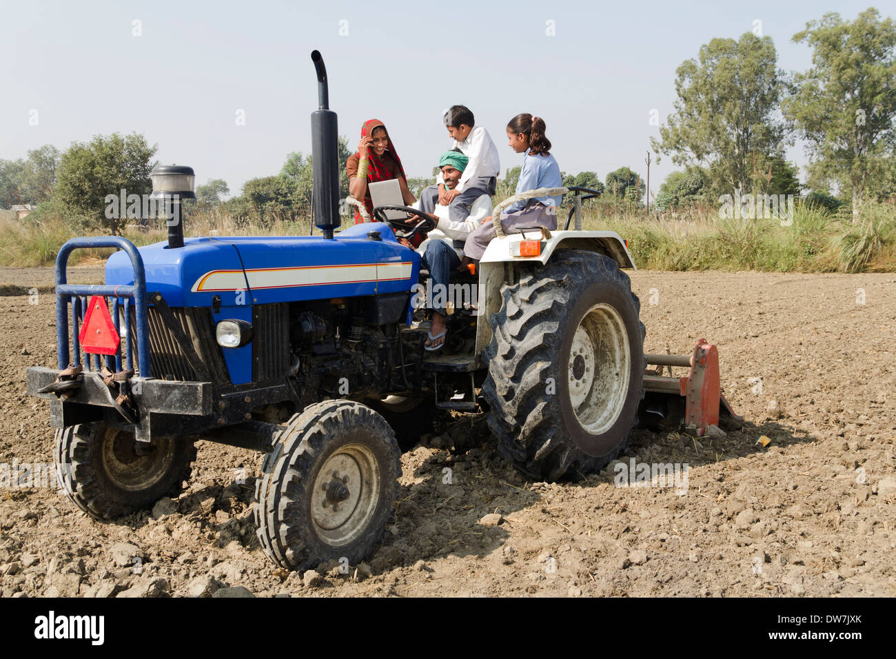 Indian family on tractor hi-res stock photography and images - Alamy