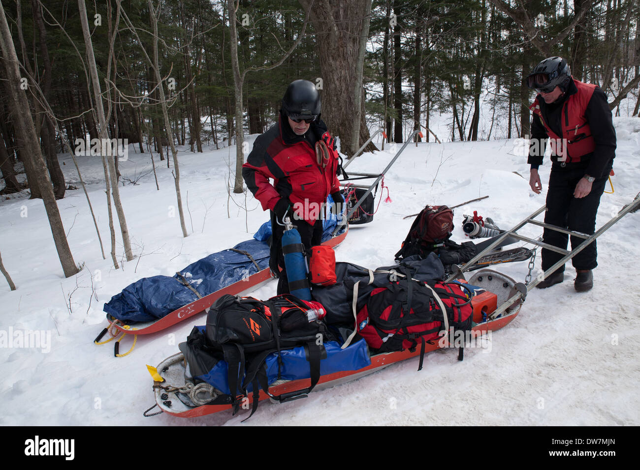 Two members of the Thunderbolt Ski Patrol check their pull sleds after ...