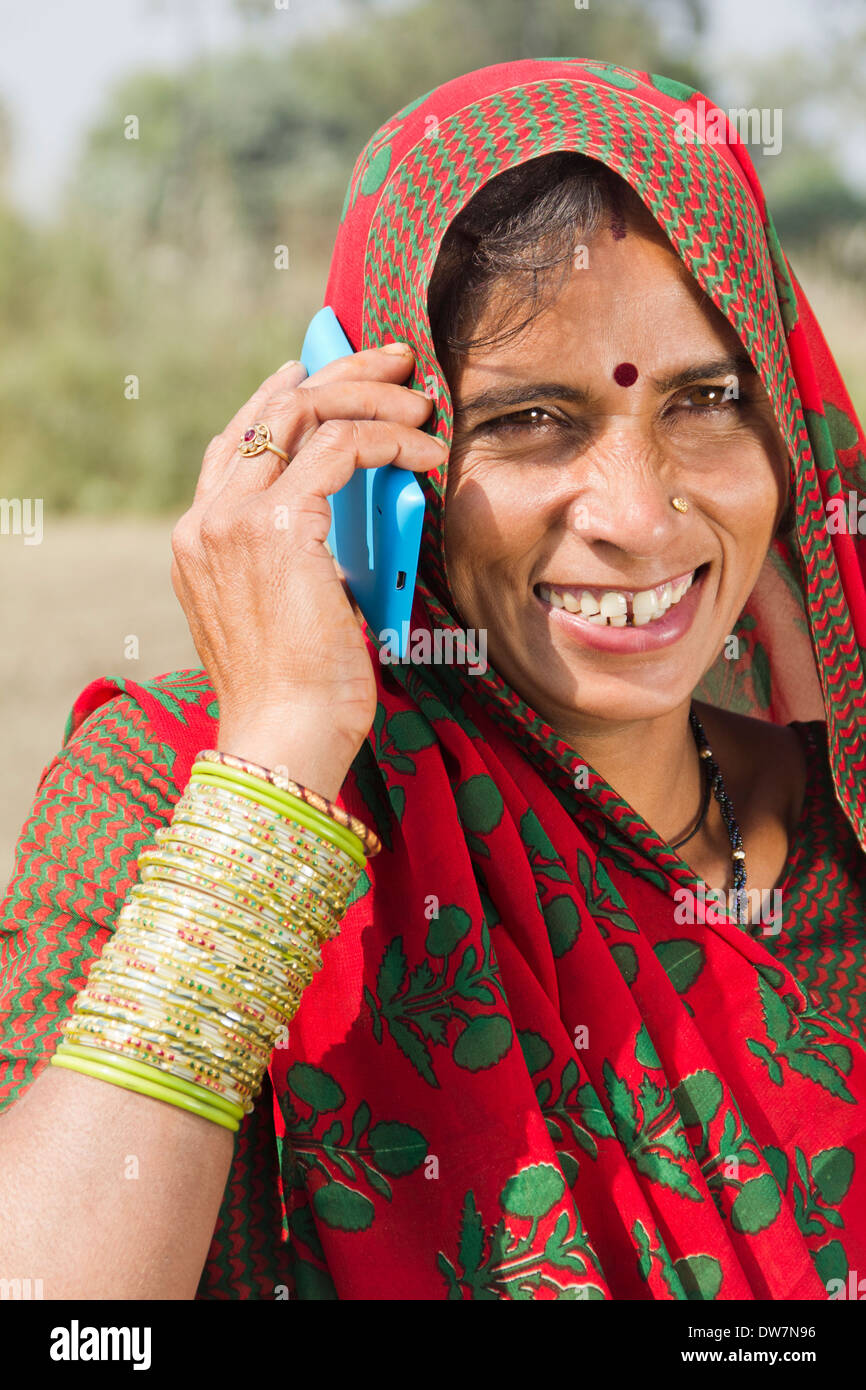 1 Indian woman talking with mobile Stock Photo - Alamy