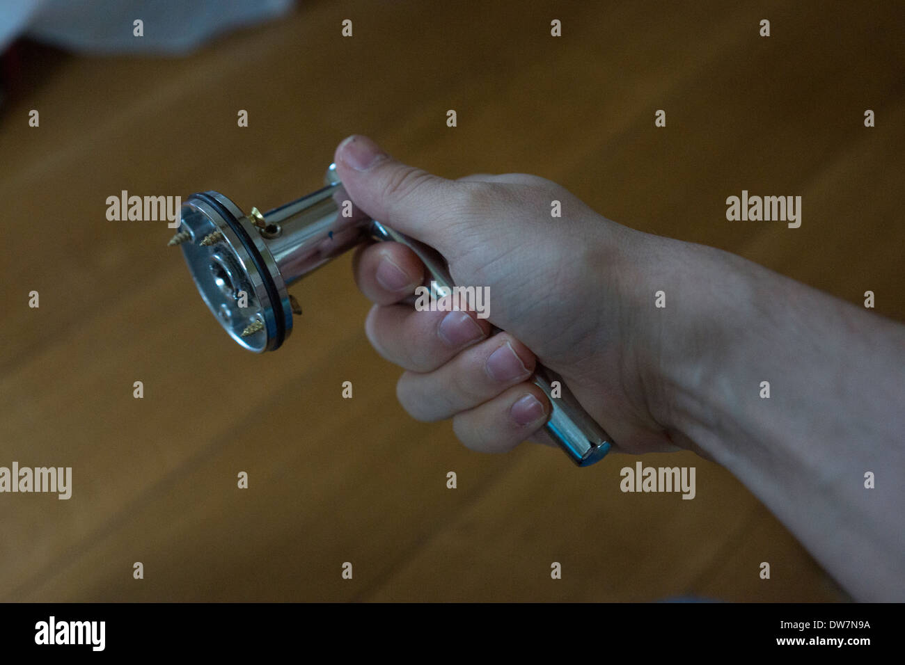 arm hand holding griping door handle handles Stock Photo - Alamy