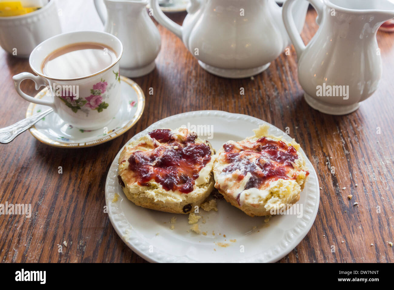 Traditional cream tea with scone, clotted cream, strawberry jam and a ...