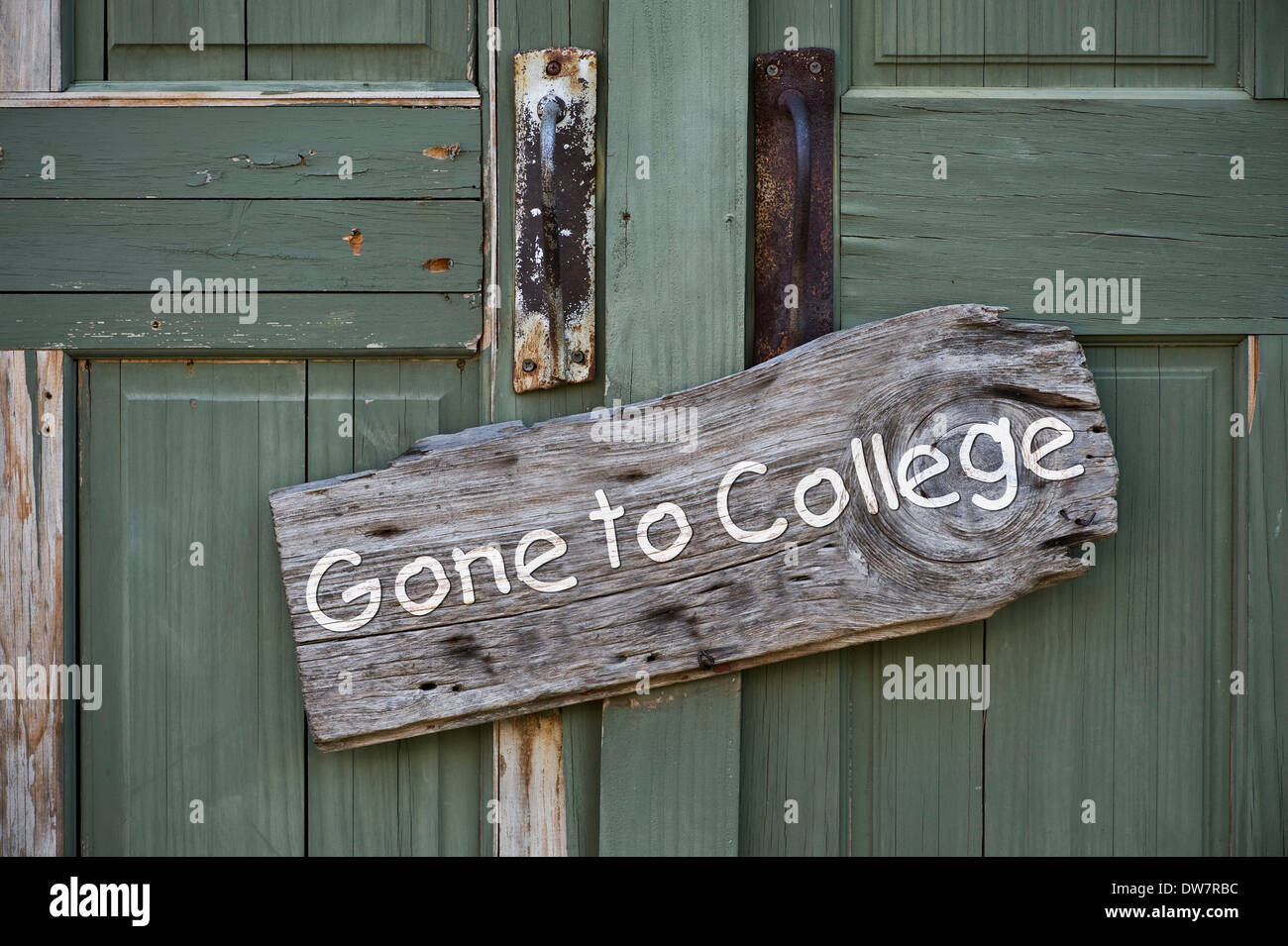 Old gone to college sign on doorway Stock Photo - Alamy