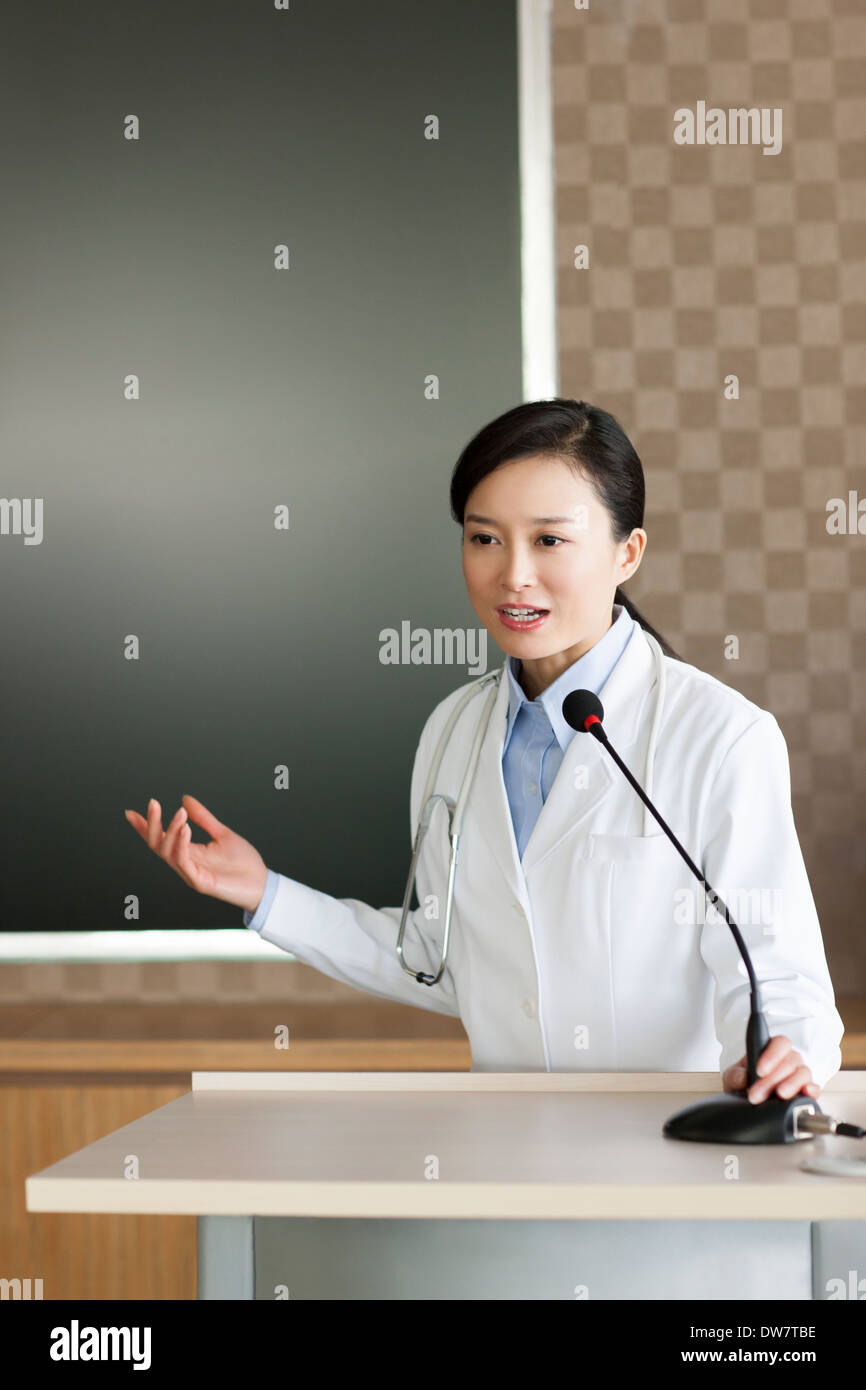 Female doctor giving a speech Stock Photo - Alamy