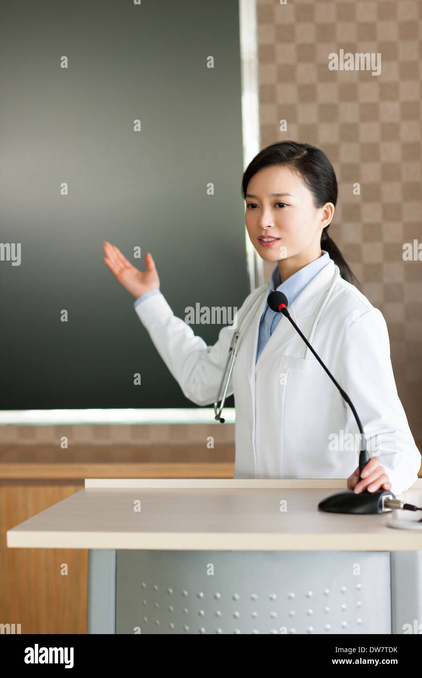 Female doctor giving a speech Stock Photo - Alamy