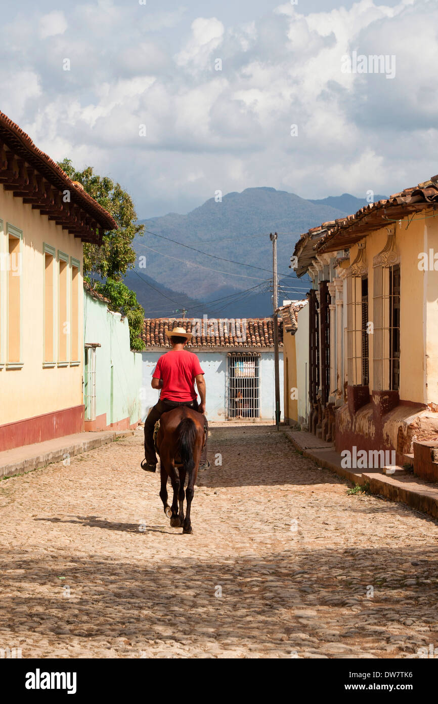 Cuban man riding a horse in the streets in Trinidad, Cuba Stock Photo ...