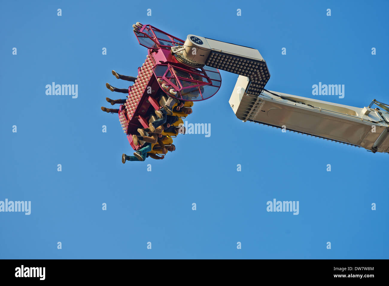 Claw which is a ride that spins people upside down. a carnival ride on ...
