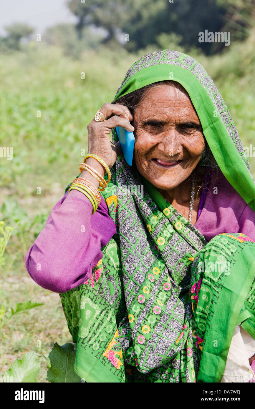 1 Indian old woman talking with mobile Stock Photo - Alamy