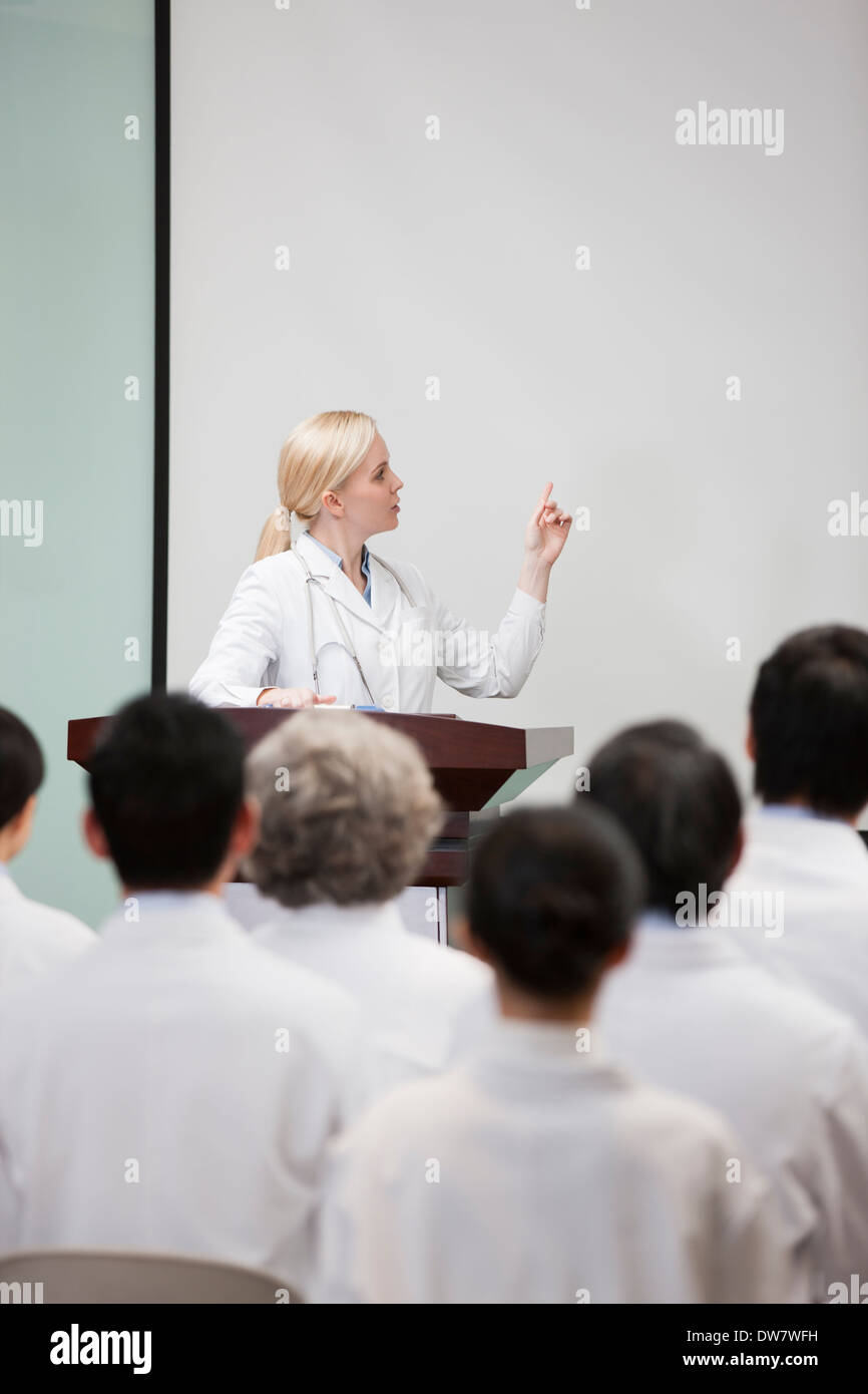 Smiling female speaker giving hi-res stock photography and images - Alamy