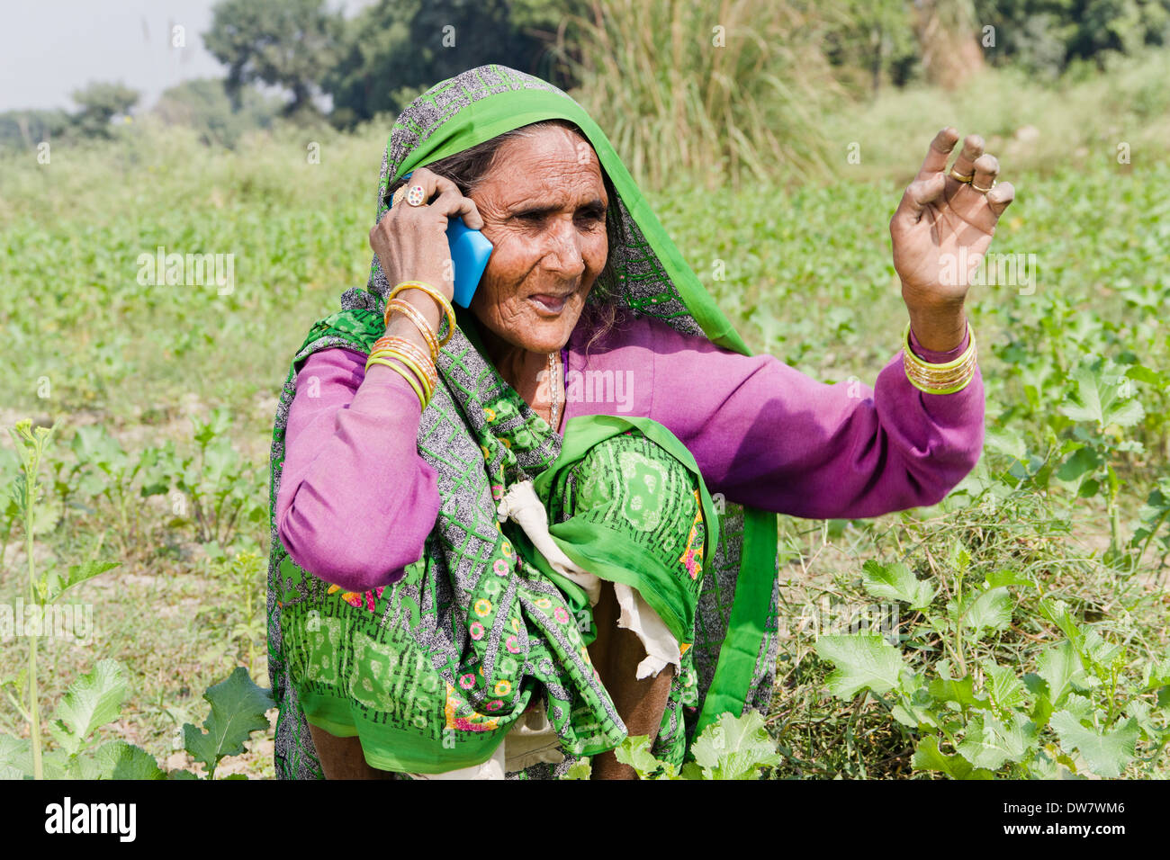 1 Indian old woman talking with mobile Stock Photo - Alamy
