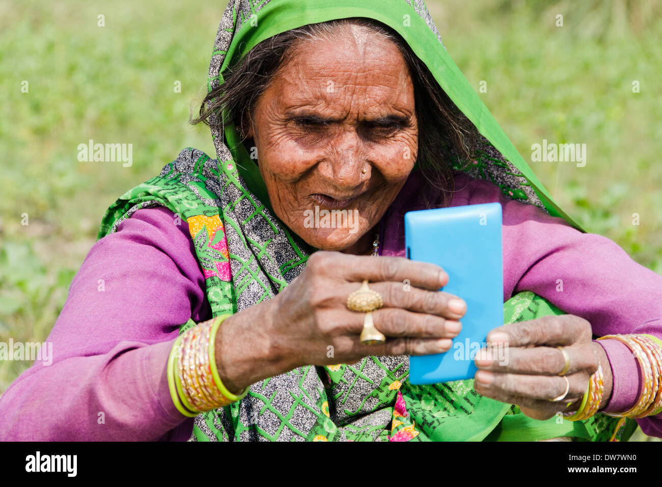 Indian labour use phone outdoor hi-res stock photography and images - Alamy