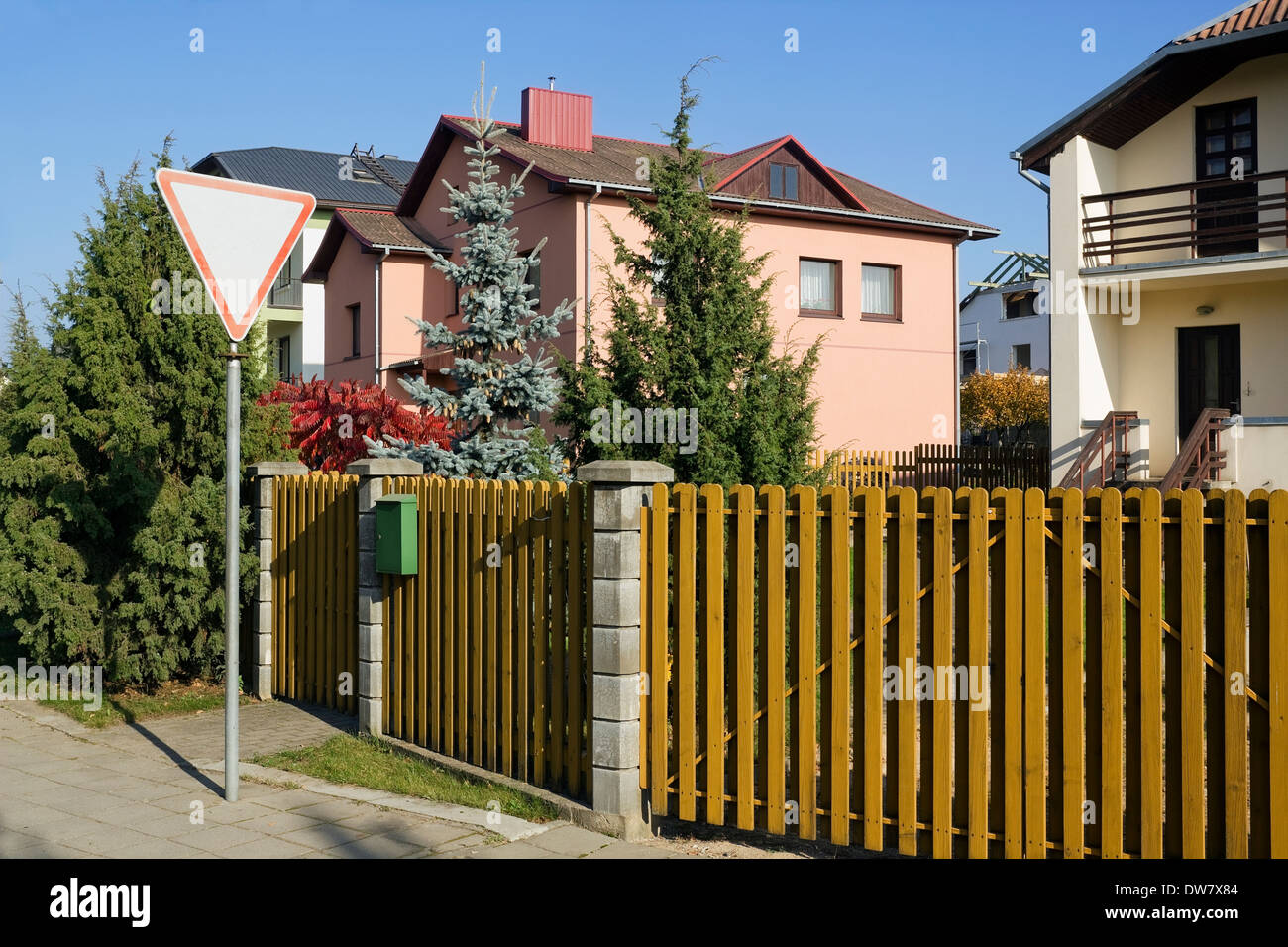 Road sign - Give Way - stands on the village street. Sunny autumn day ...