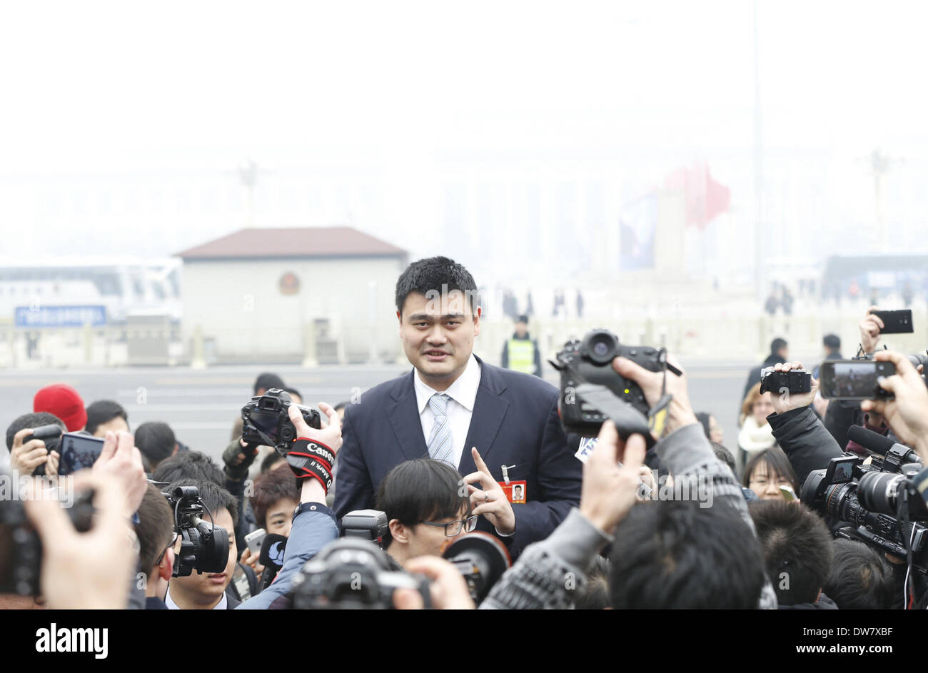 Beijing, China. 3rd Mar, 2014. Former basketball star Yao Ming (C), a ...