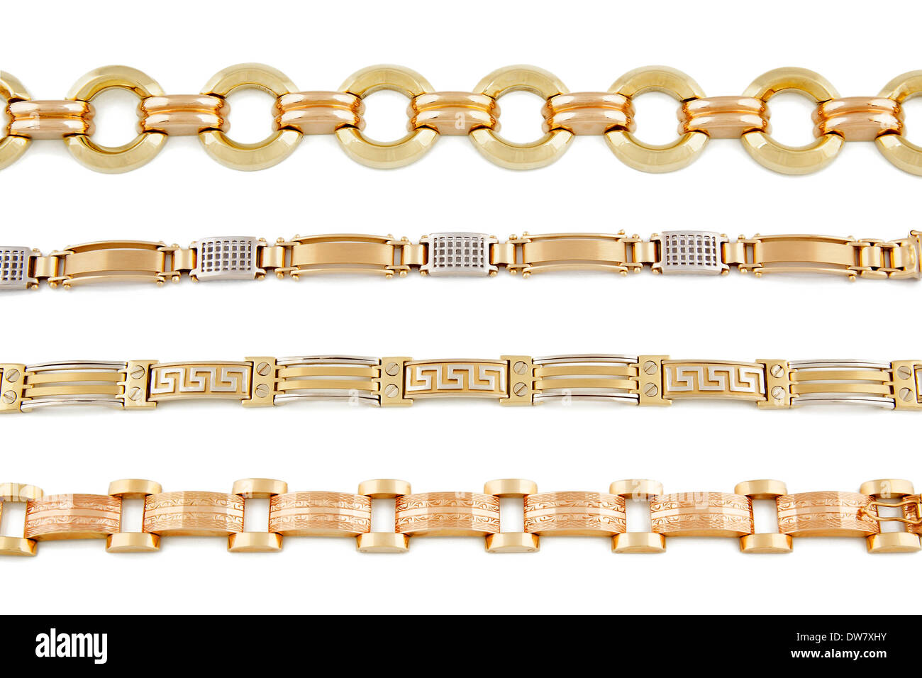 Gold jewelry on a white background Stock Photo - Alamy