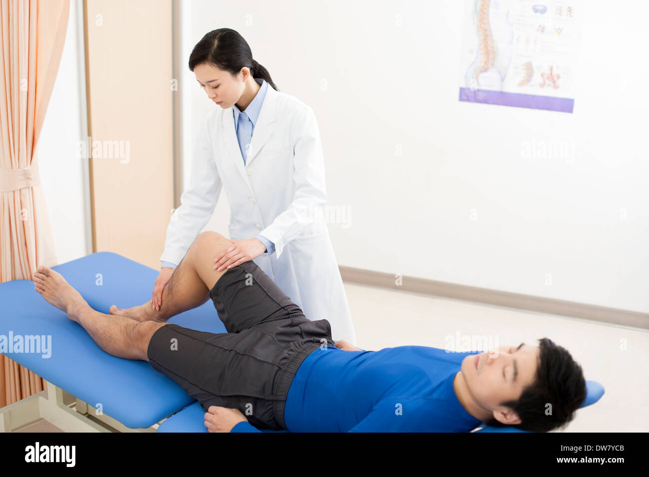 Patient lying down on an examination table hi-res stock photography and ...