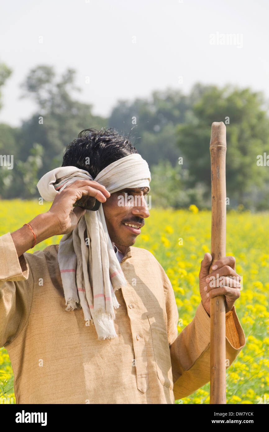 1 Indian famer standing in farms and talking Stock Photo - Alamy