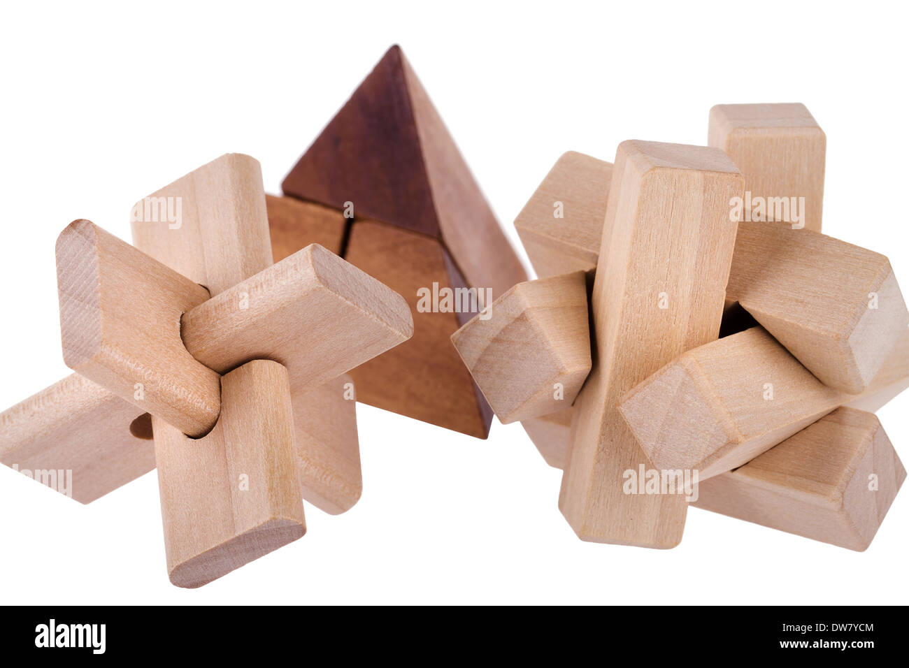 Wooden brain teasers on white background Stock Photo - Alamy