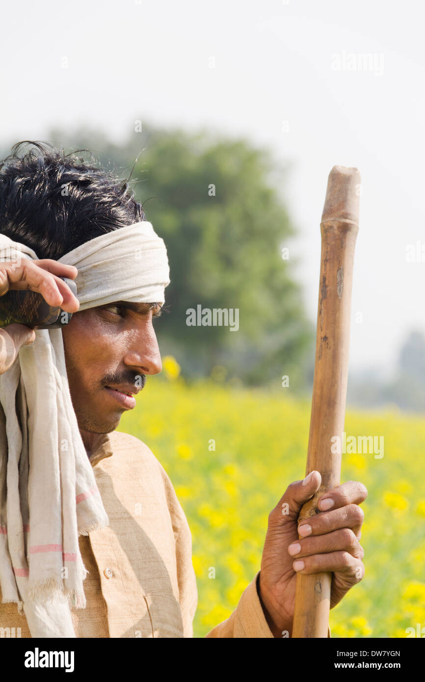 1 Indian famer standing in farms and talking Stock Photo - Alamy