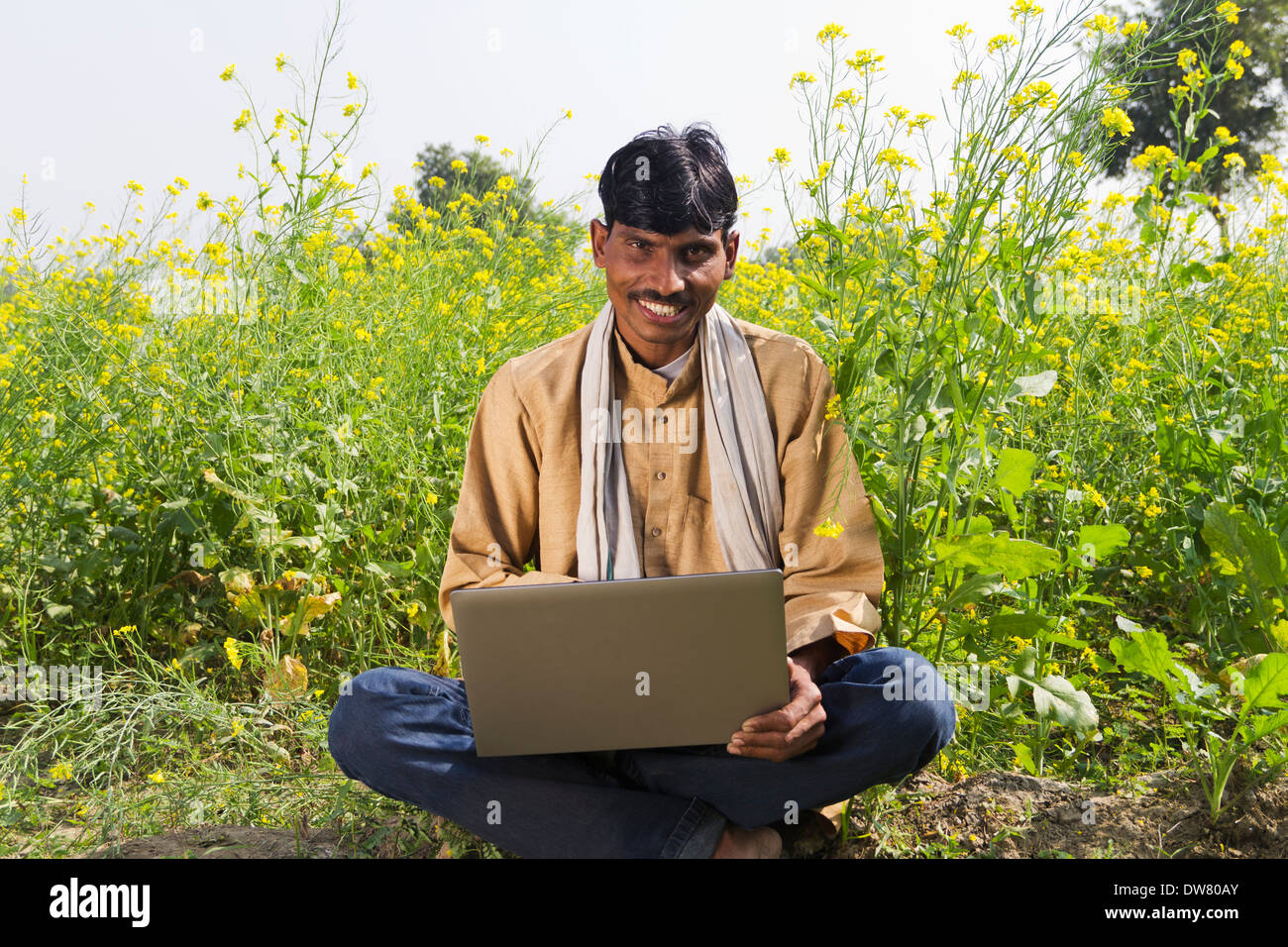 1 Indian farmer sitting with laptop Stock Photo - Alamy