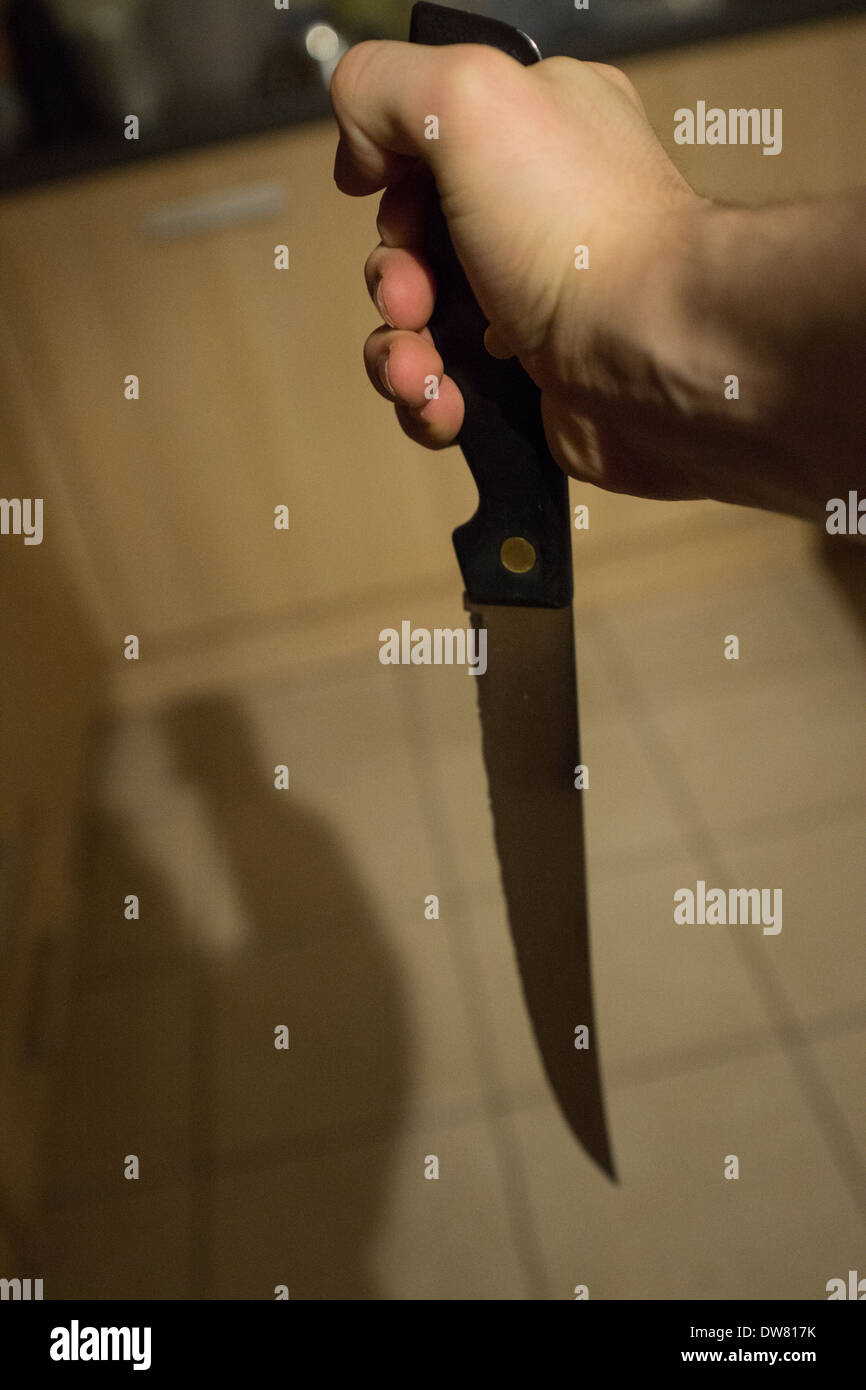 kitchen Knife teenager hand long sharp blade Stock Photo - Alamy