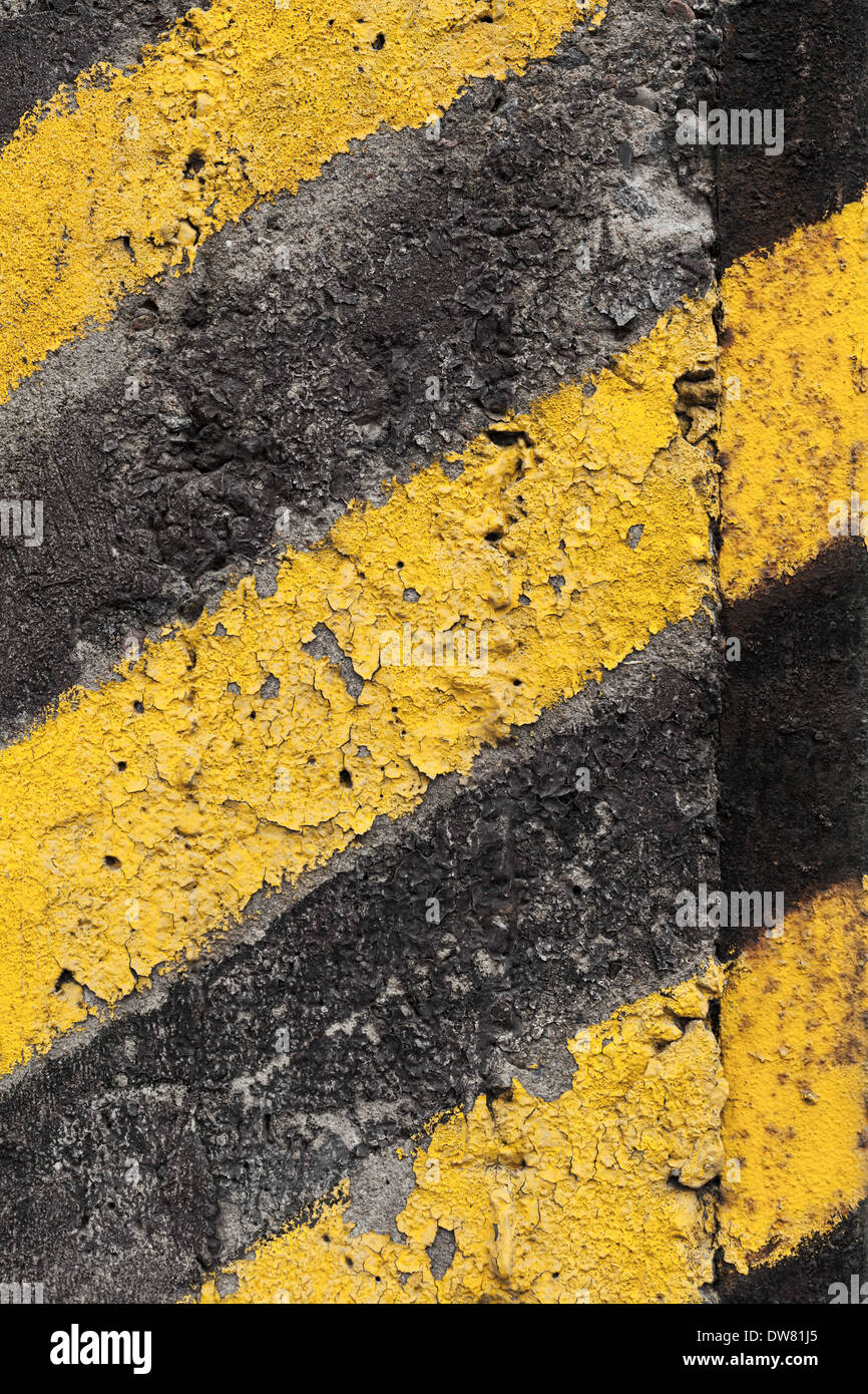 Black and yellow striped caution pattern on old concrete wall Stock ...