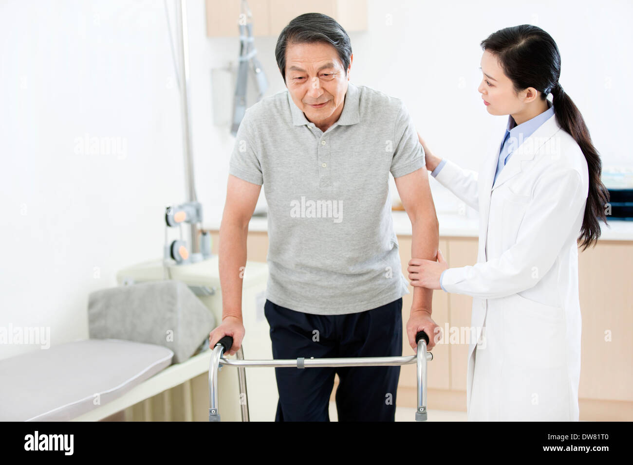 Rehabilitation walker doctor walking hi-res stock photography and ...