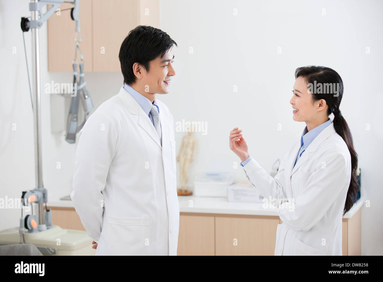Happy doctors talking Stock Photo - Alamy