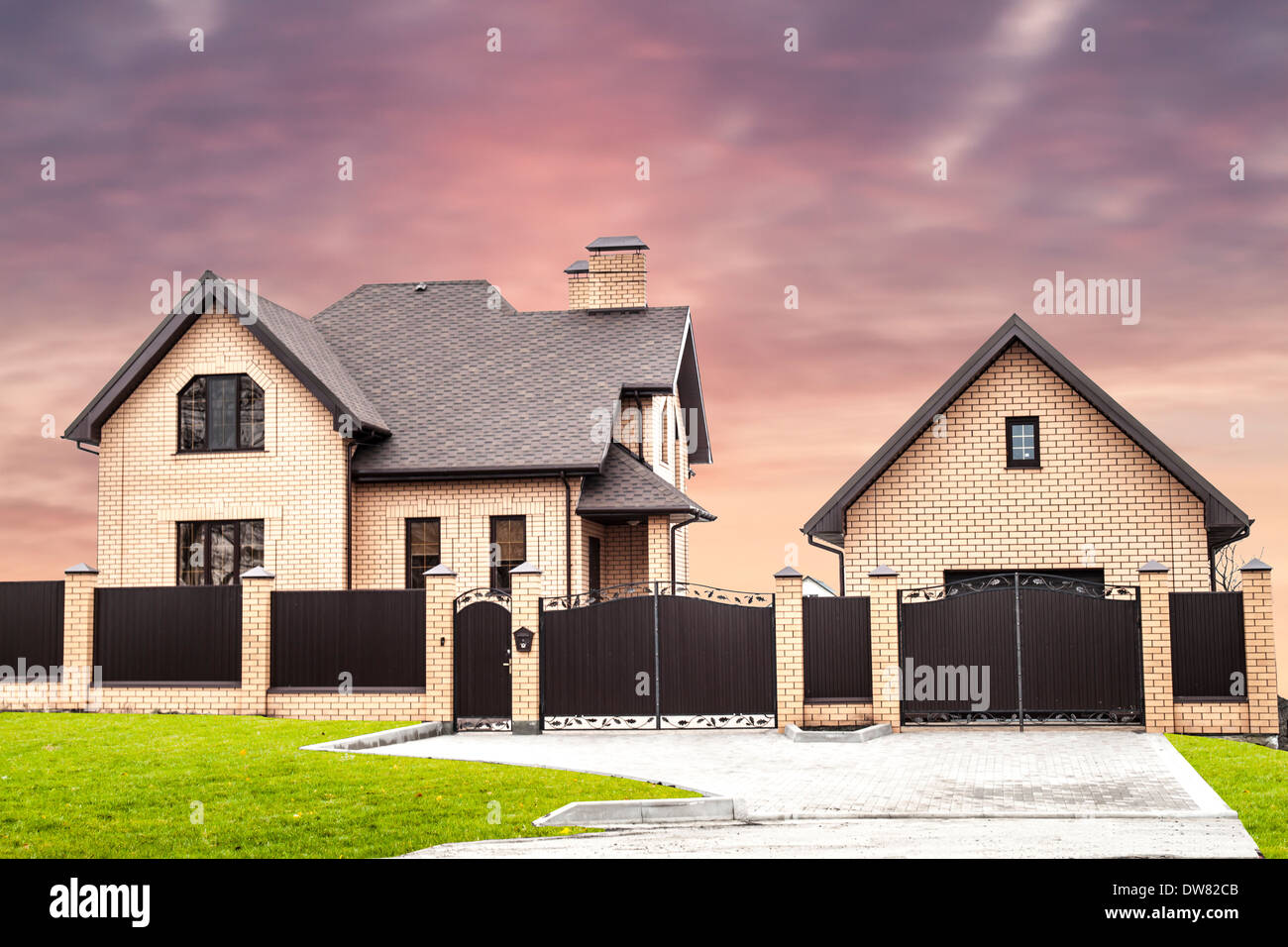 Photo of a country house at sunset Stock Photo - Alamy